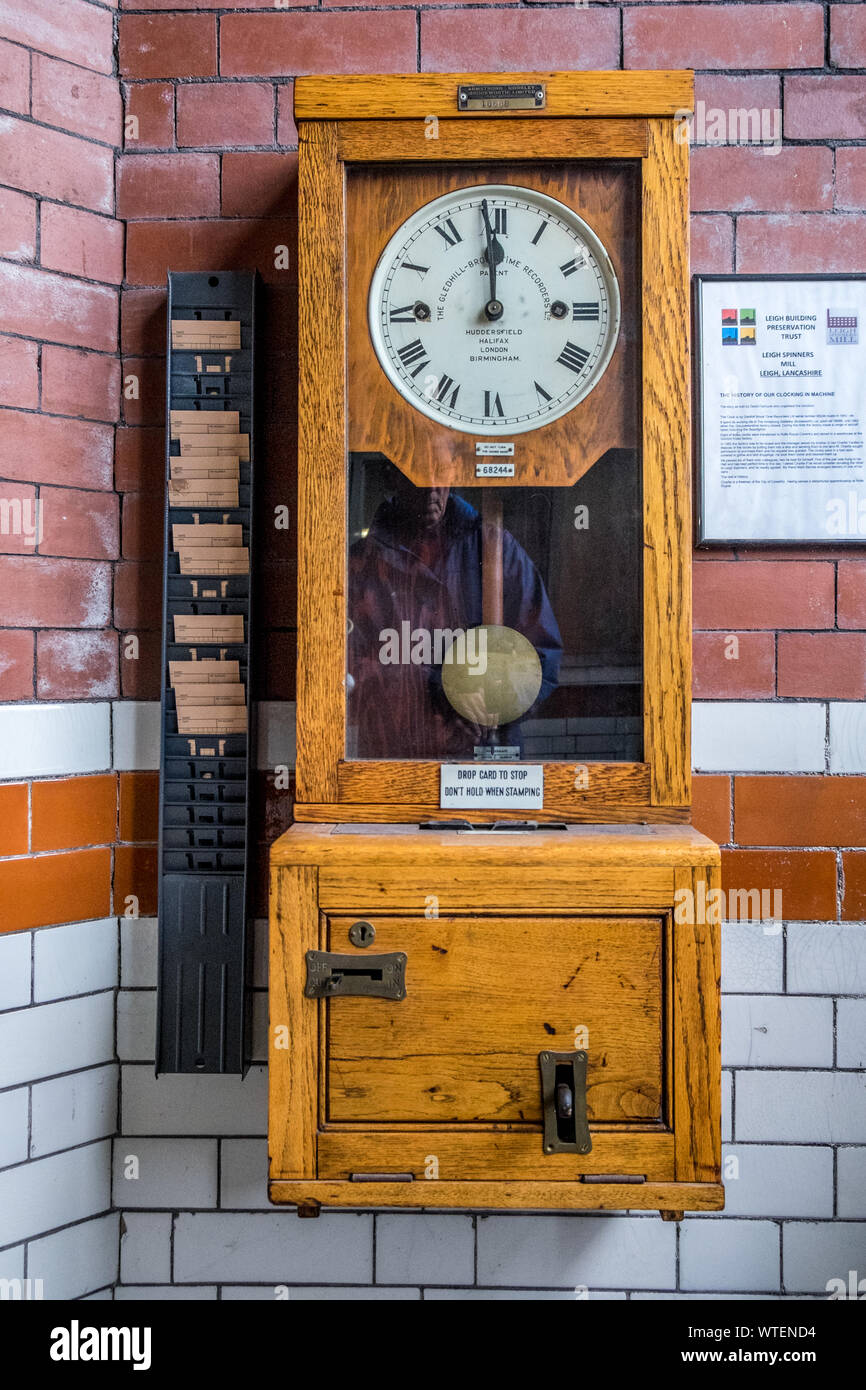 Old fashioned clocking in clock hi-res stock photography and images - Alamy