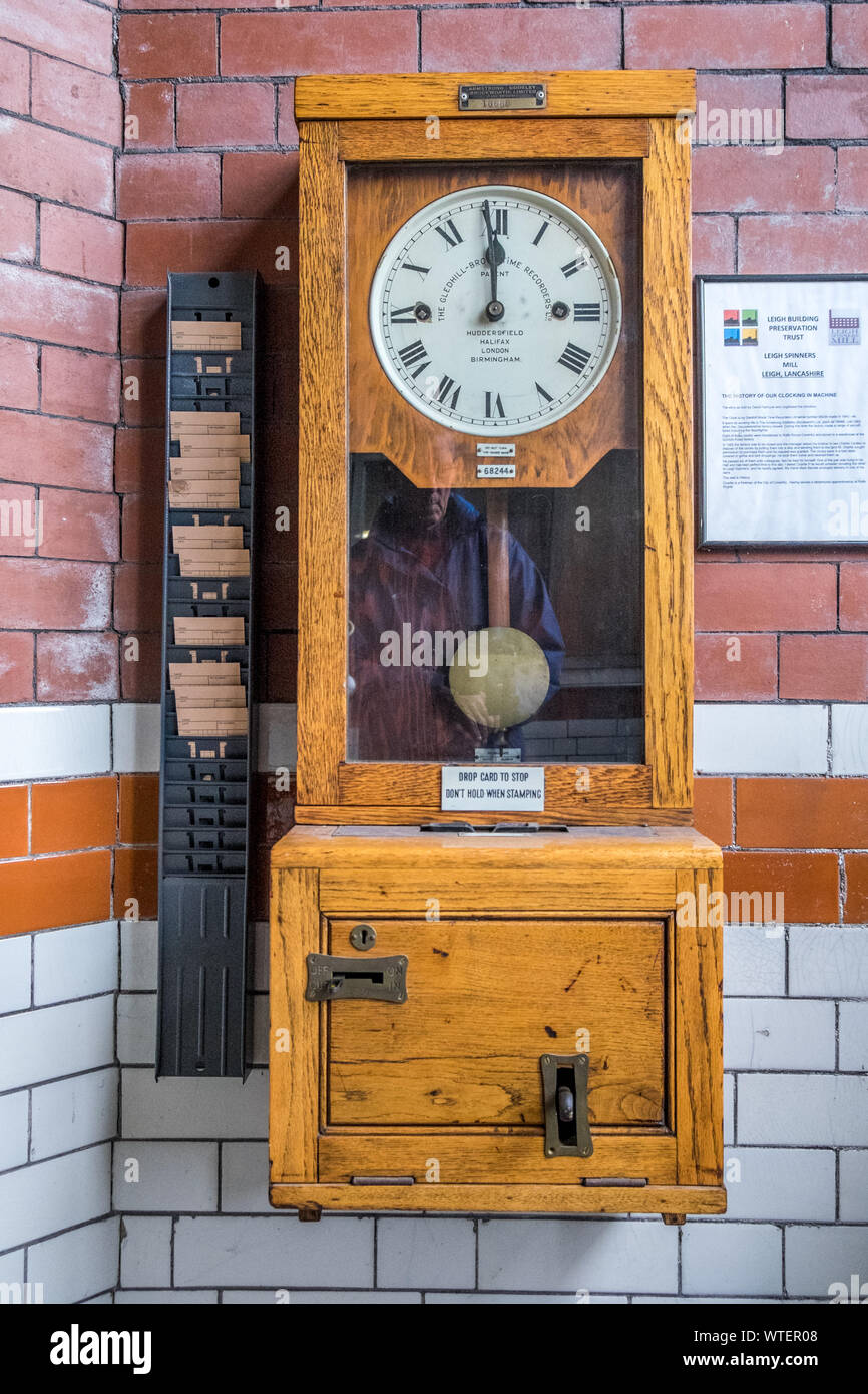 Clocking in clock in factory entrance Stock Photo - Alamy