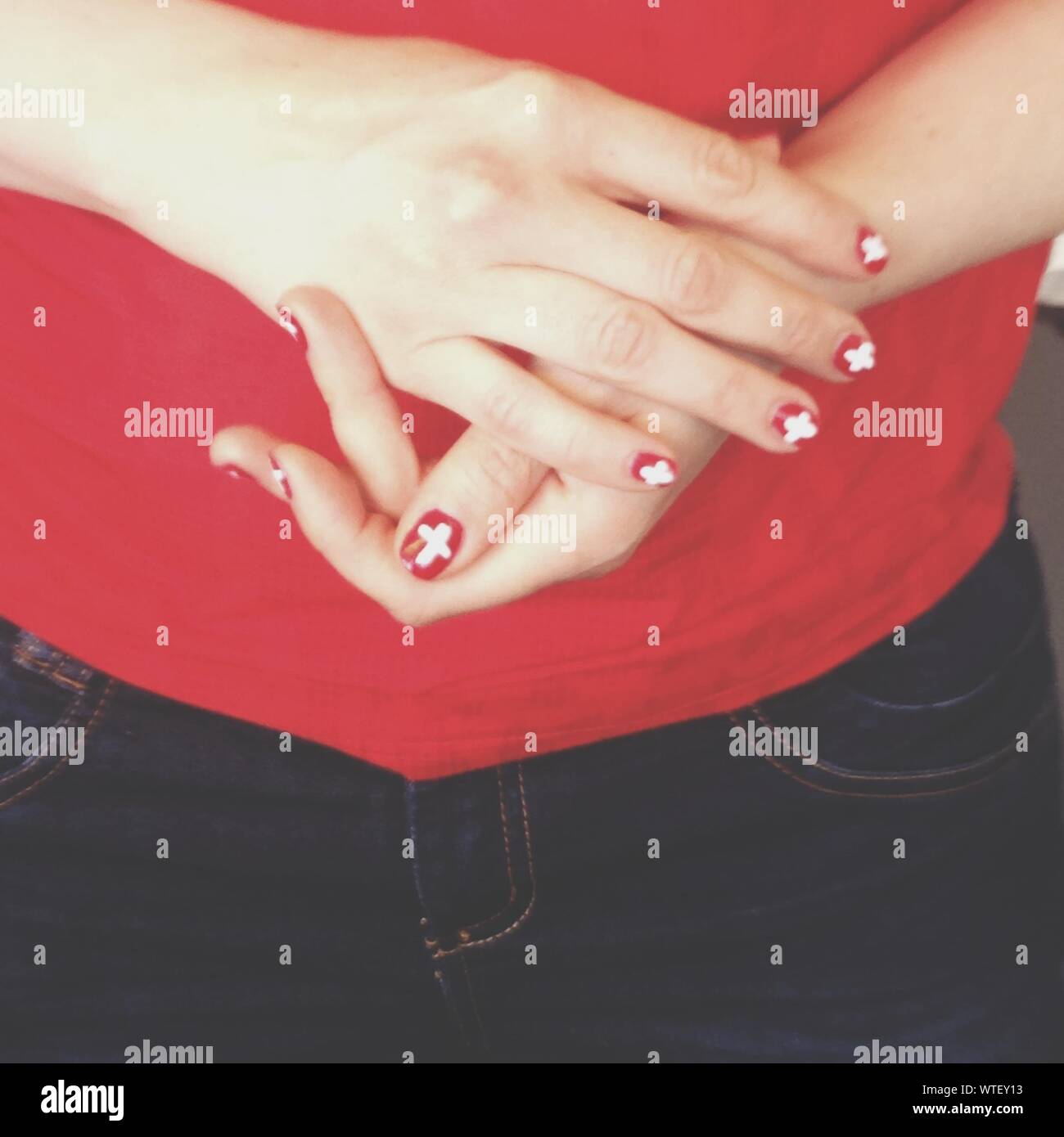 Hands on the cross hi-res stock photography and images - Alamy