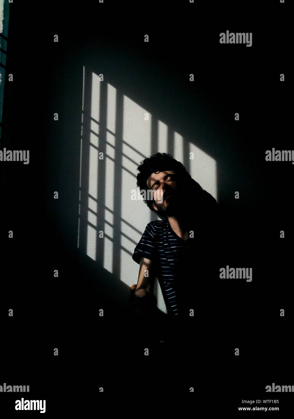 Shadow of man sitting hi-res stock photography and images - Alamy
