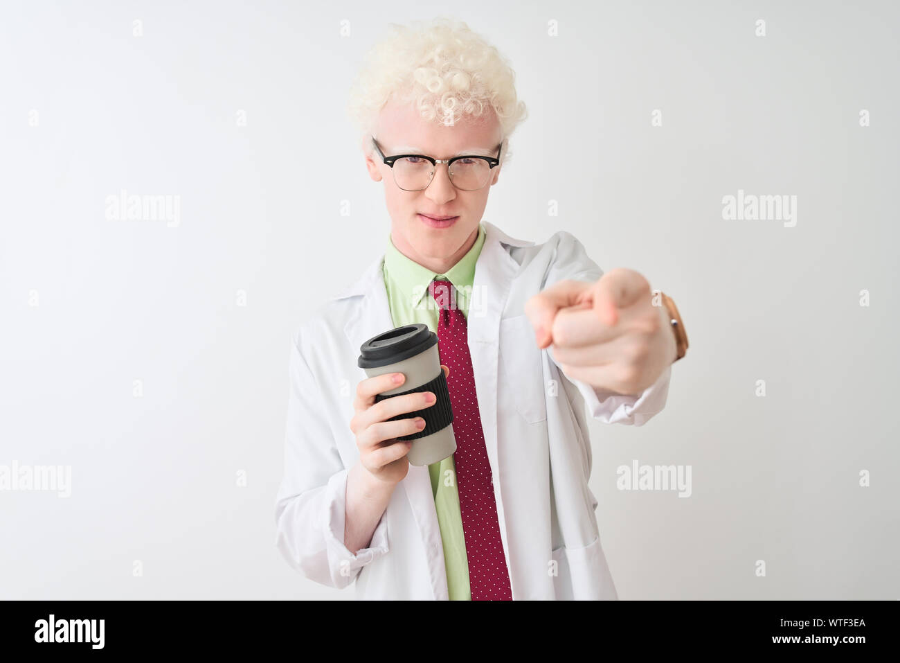 Albino scientist man wearing glasses drinking take away coffee over ...