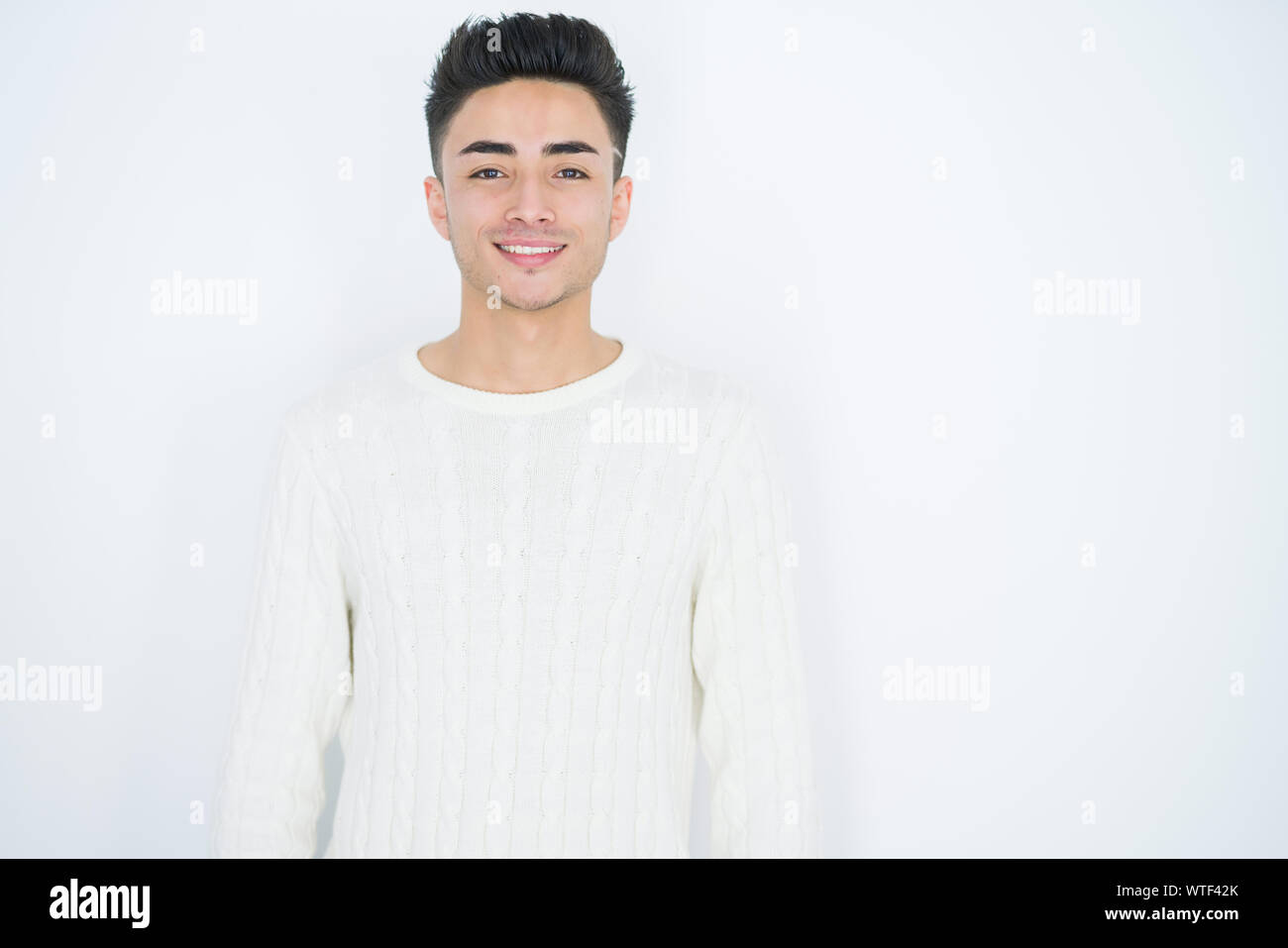 Handsome young man over white isolated background with a happy and cool ...