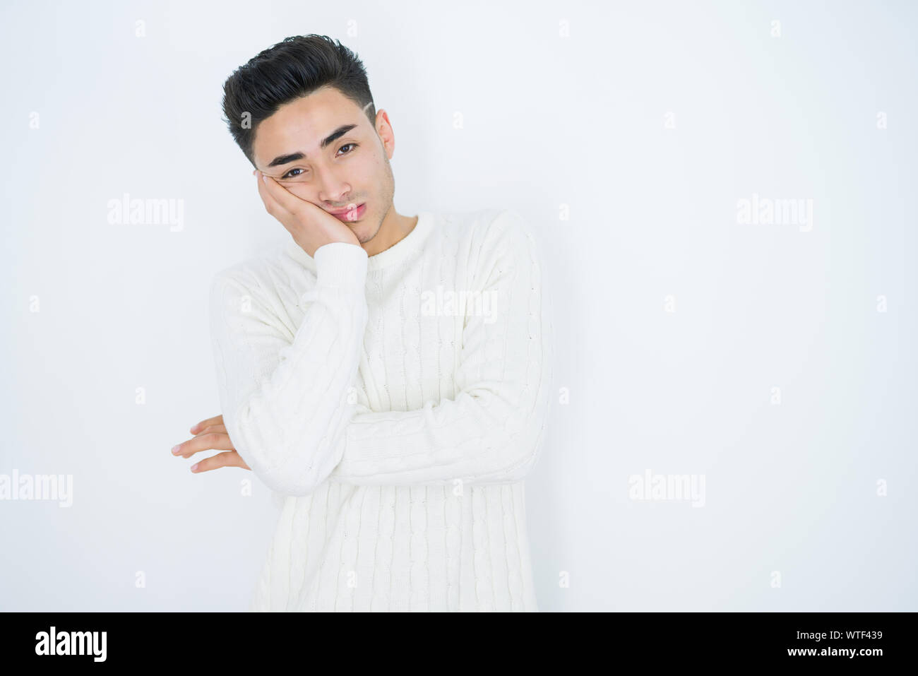 Handsome young man over white isolated background thinking looking ...