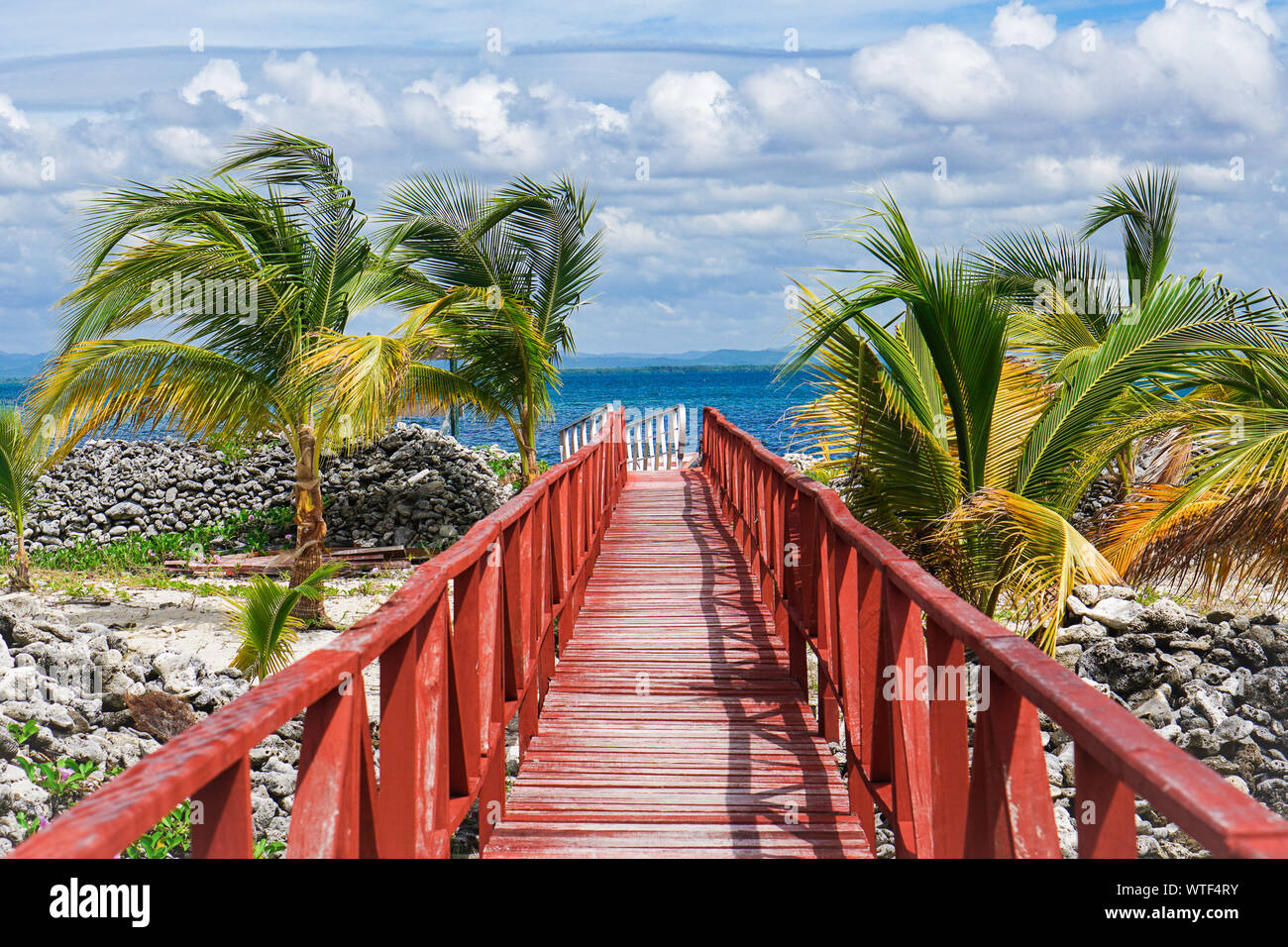 Red pier on a tropical Island Stock Photo - Alamy