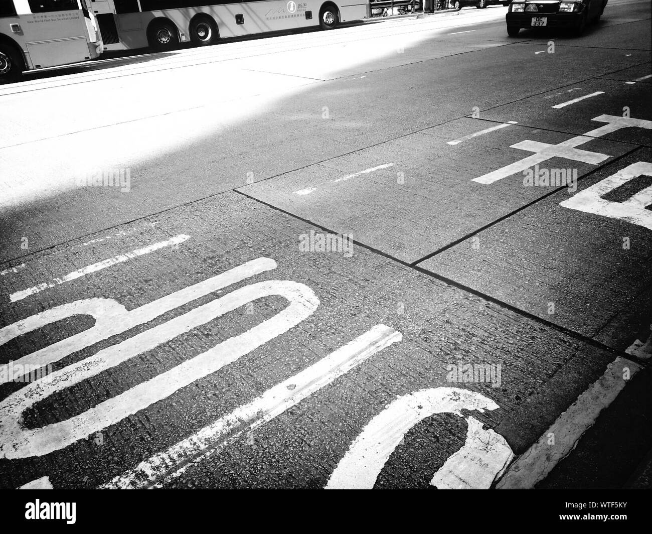 Bus stop marking Black and White Stock Photos & Images - Alamy