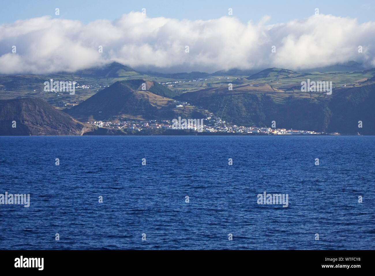 Volcanic craters and the town of Velas Sao Jorge Island Azores Portugal ...
