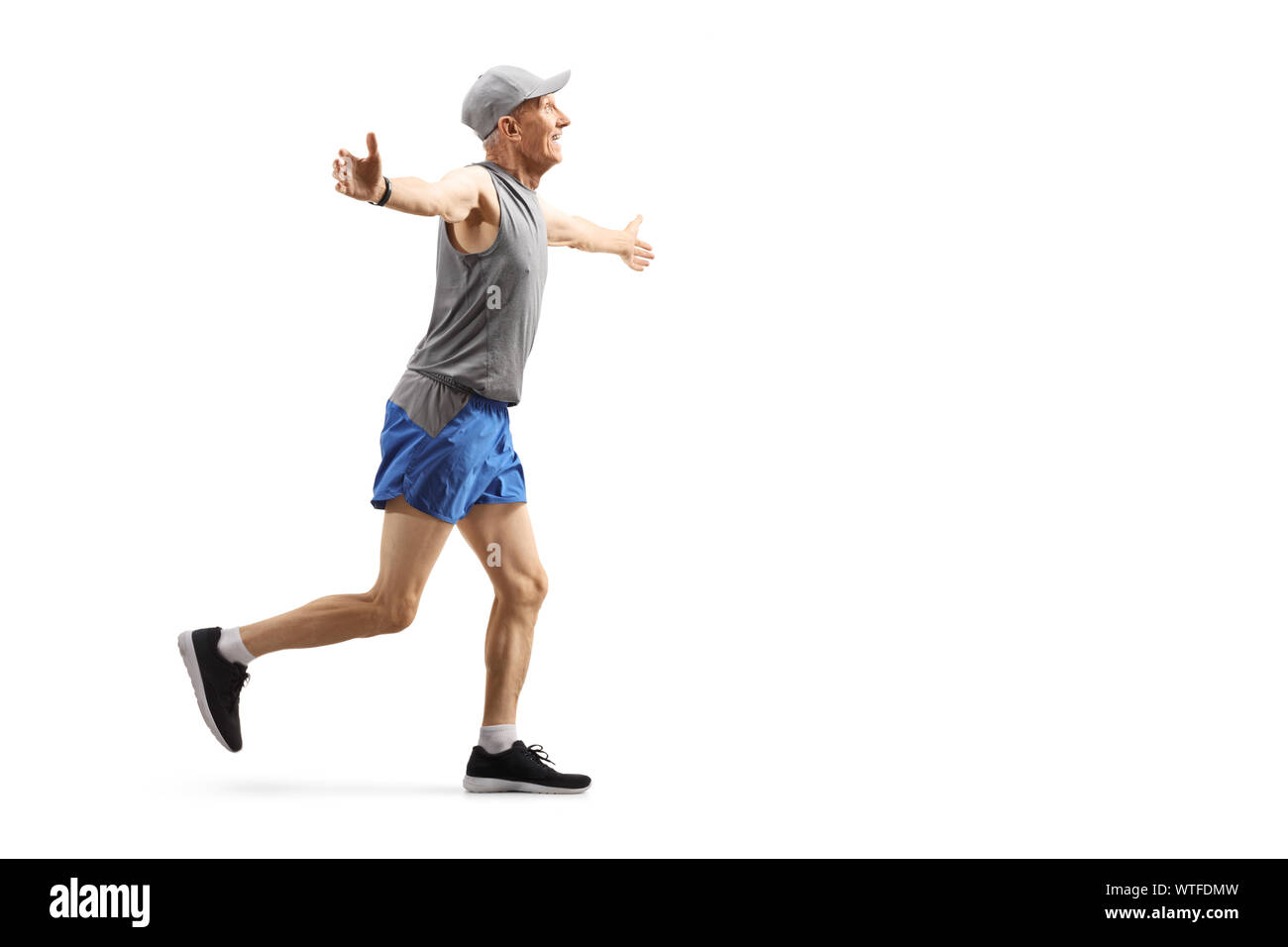 Full length profile shot of a senior man running and spreading arms ...