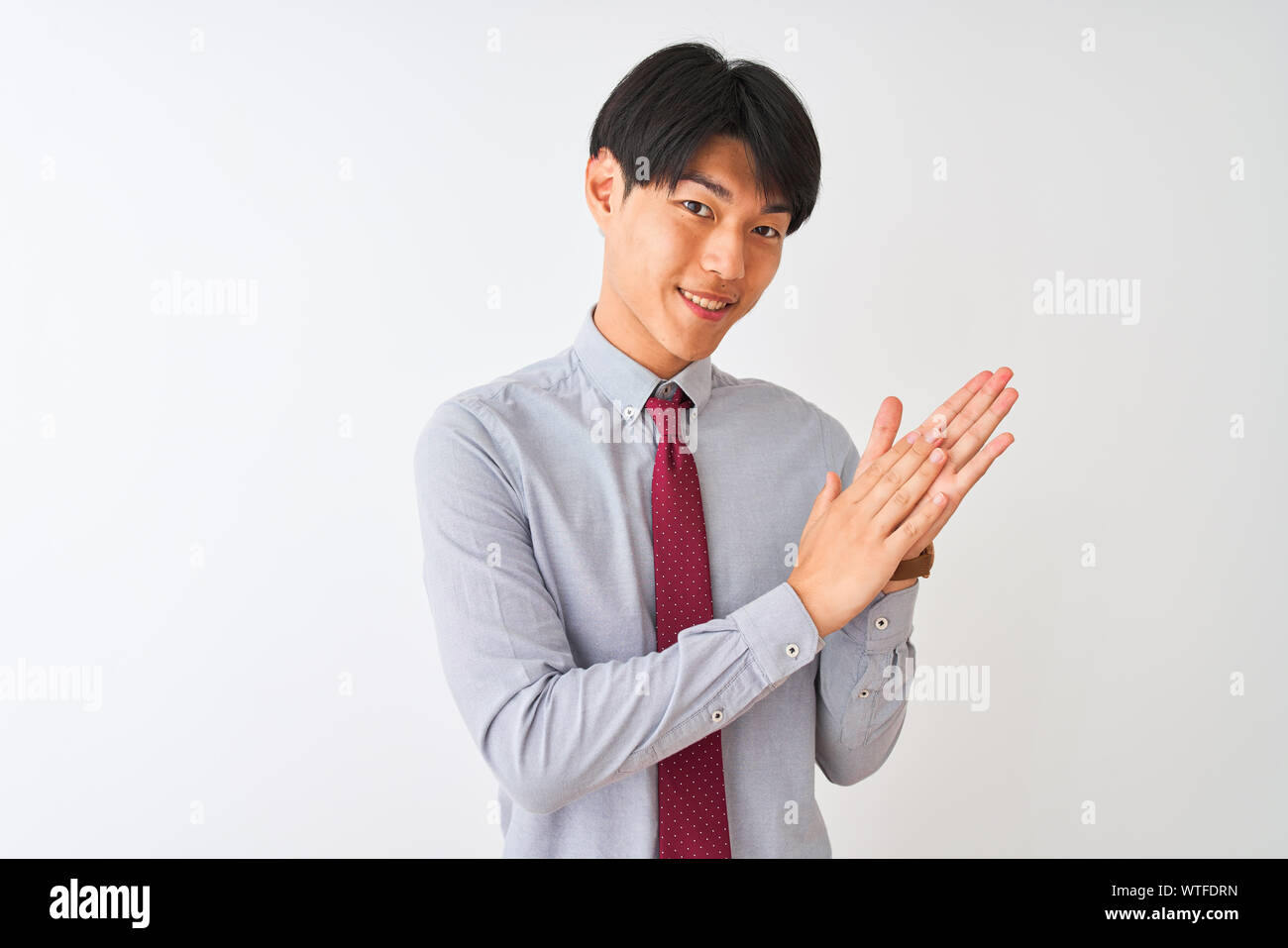 Chinese businessman wearing elegant tie standing over isolated white ...