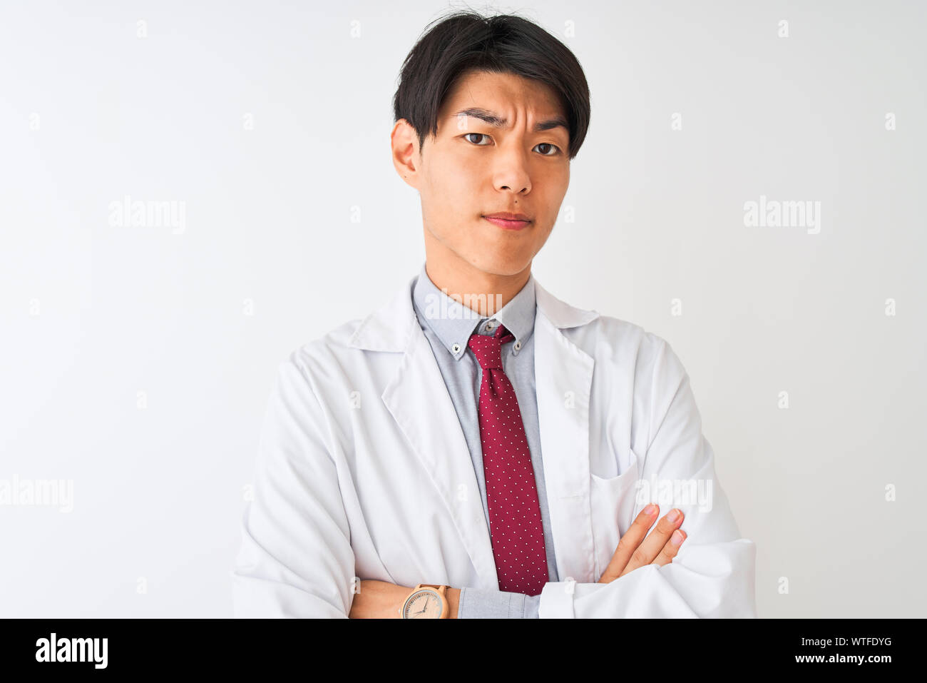 Chinese scientist man wearing tie and coat standing over isolated white ...