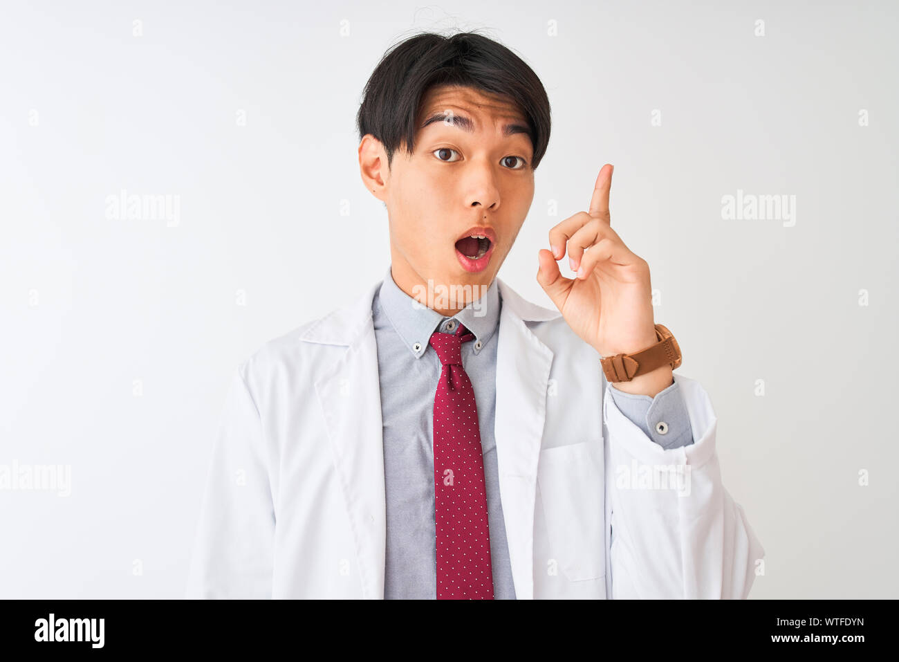 Chinese scientist man wearing tie and coat standing over isolated white ...