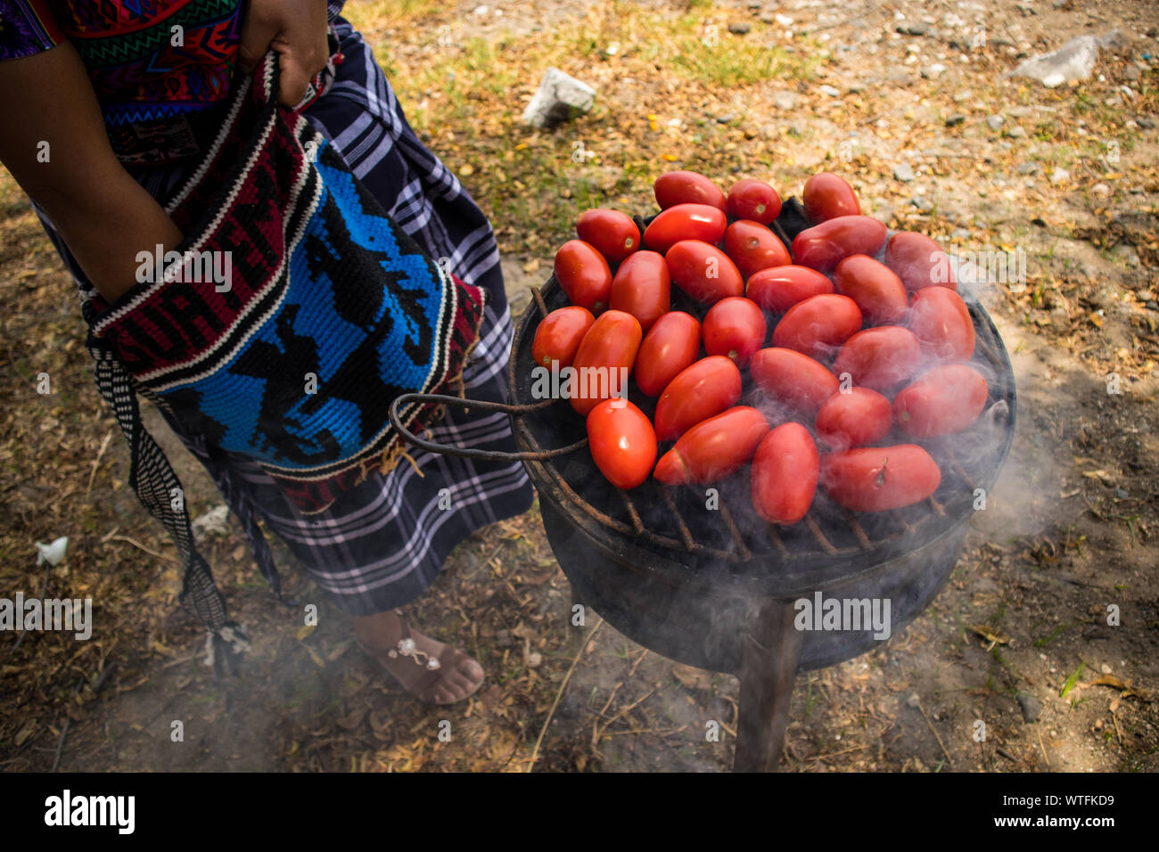Woman cooking over open fire hi-res stock photography and images - Alamy