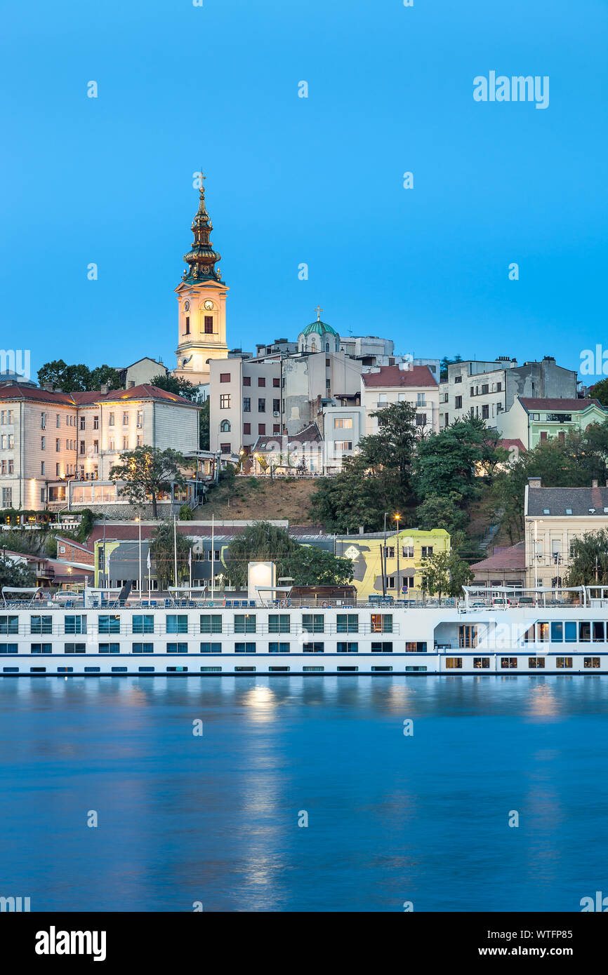 Blue hour view of Belgrade riverfront with Sava river in the foreground ...