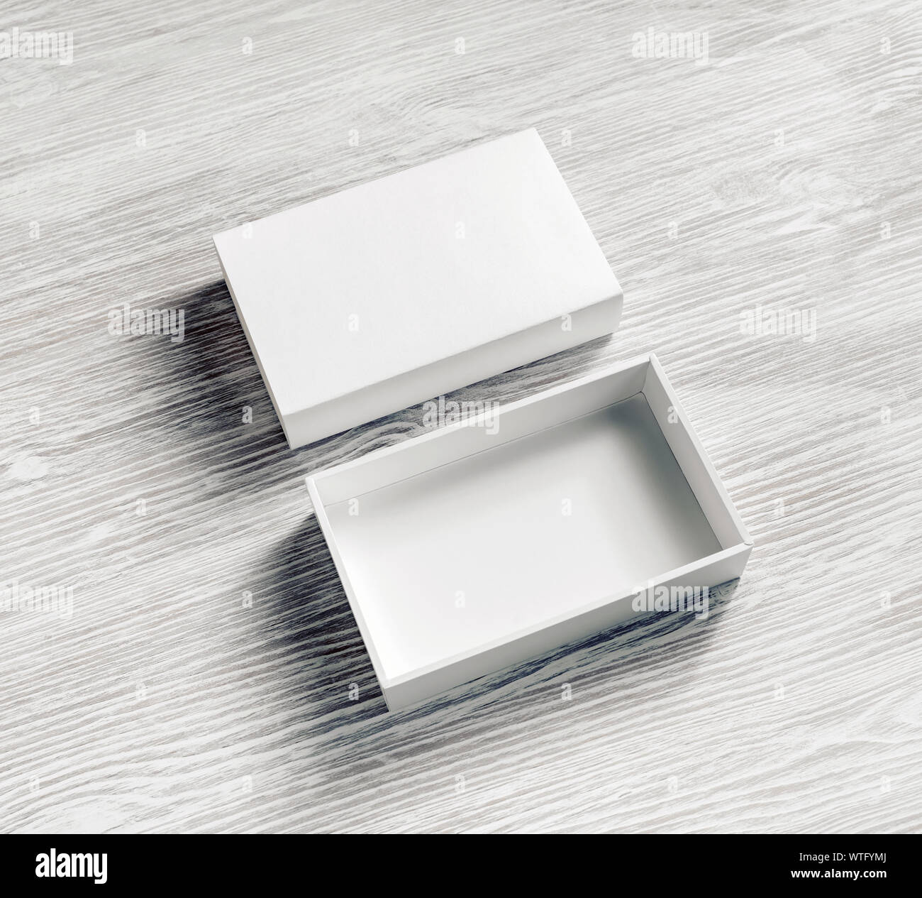 Blank paper box on light wooden background. White box mockup. Branding ...