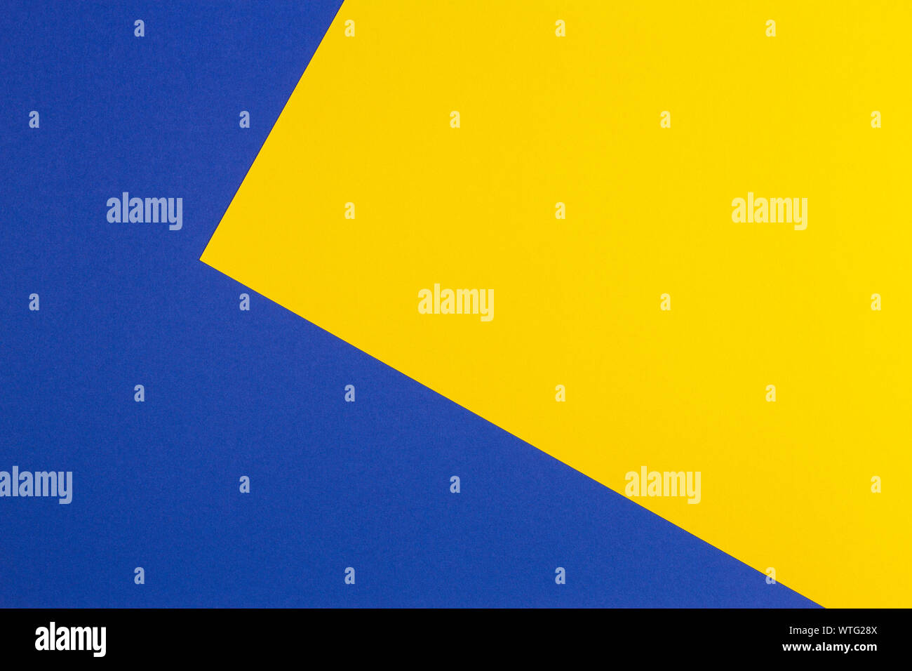Abstract colored paper blue yellow background Stock Photo - Alamy