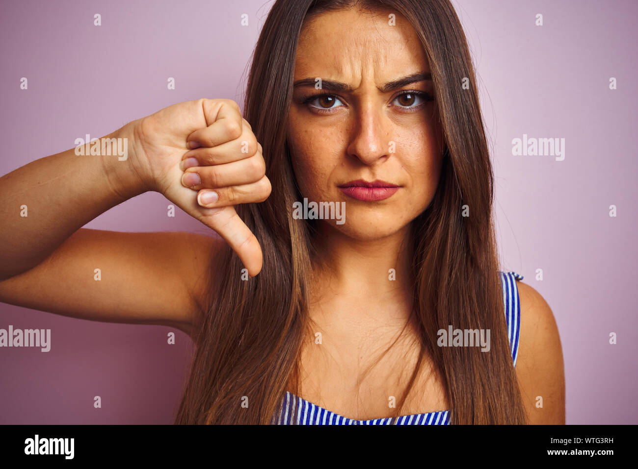 Young Beautiful Woman Wearing T Shirt Standing Over Isolated Pink