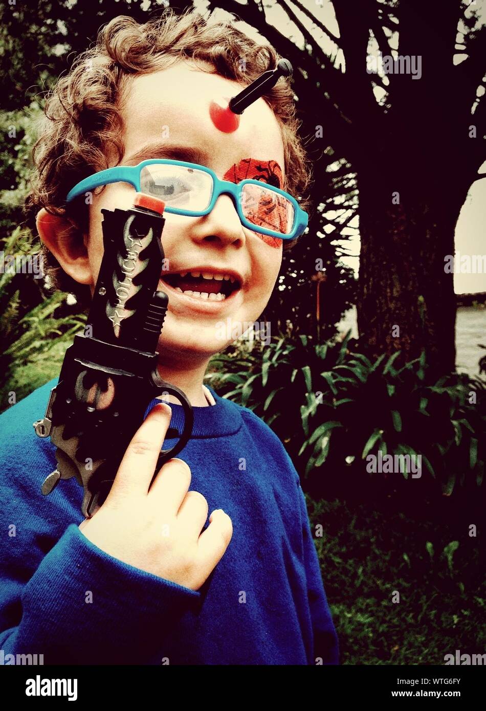 Boy playing with gun hi-res stock photography and images - Alamy