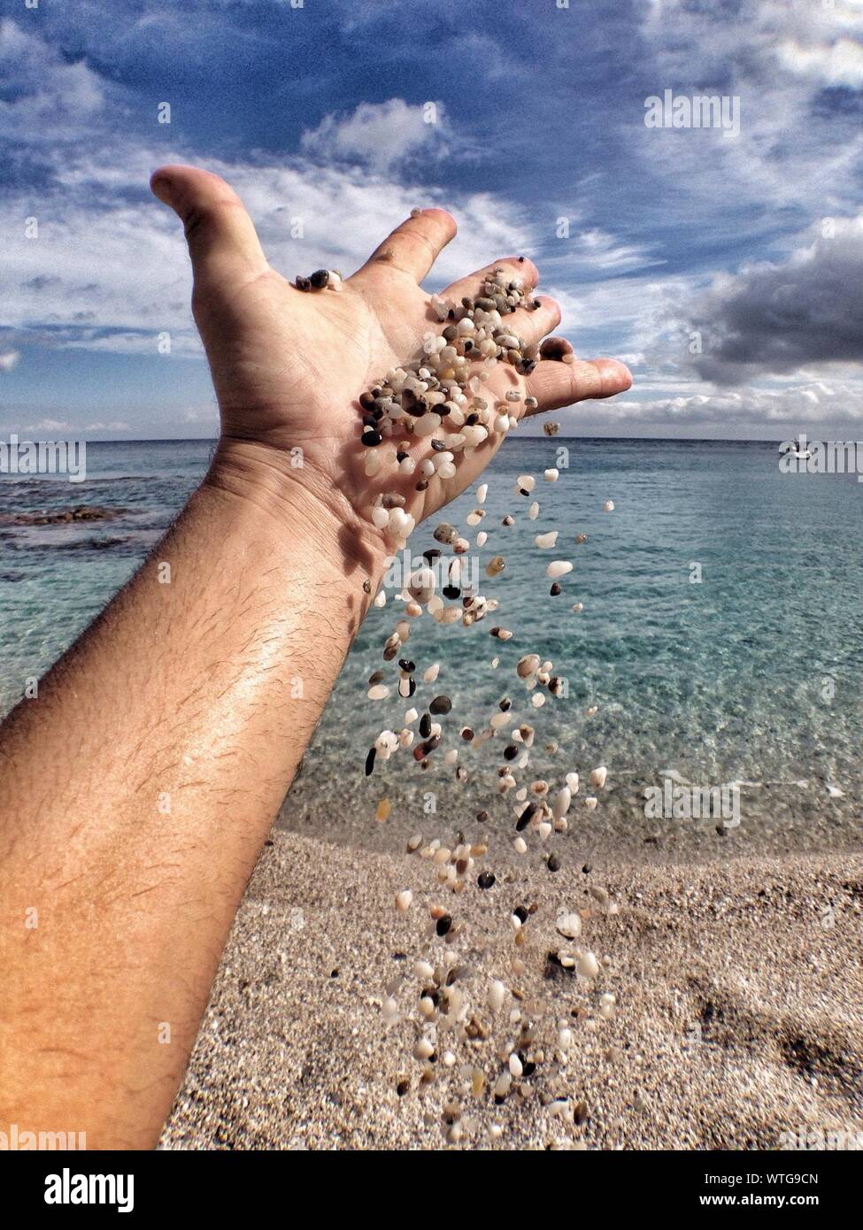 Water falling over hand hi-res stock photography and images - Alamy