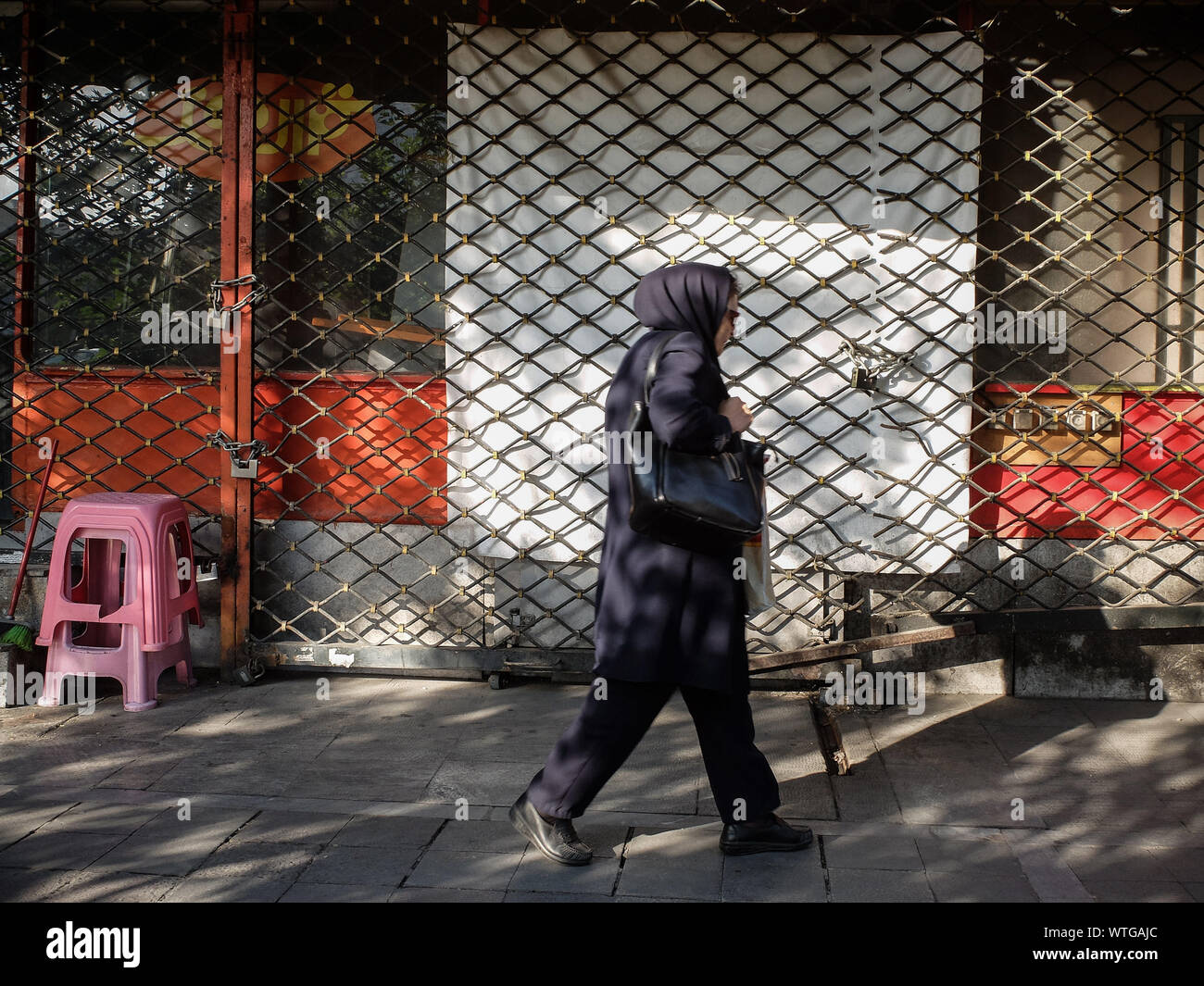 Tehran, Iran. 12th Sep, 2019. People walk on a sidewalk on Valiasr ...