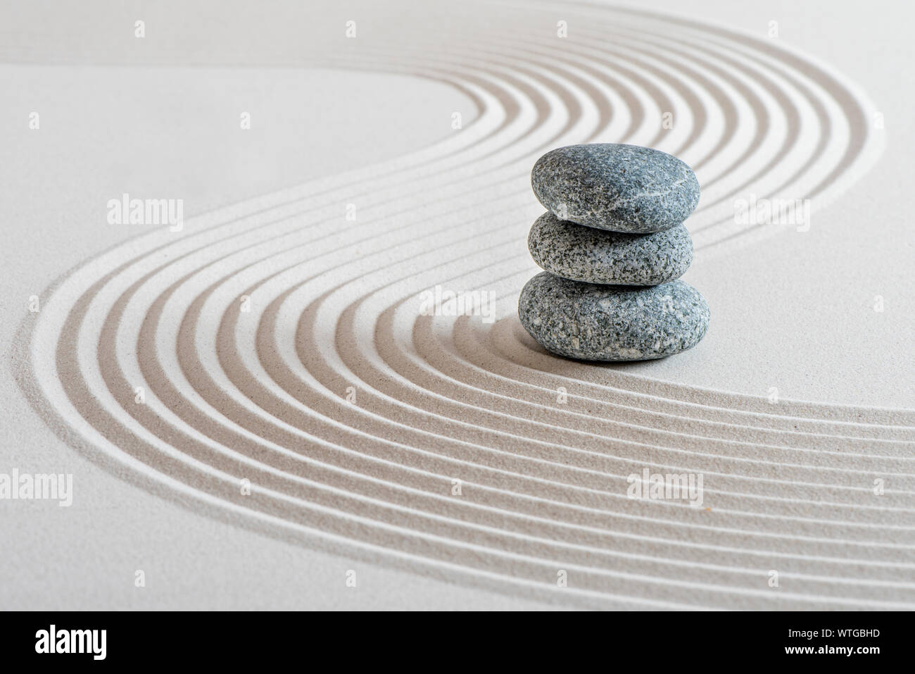 Japanese ZEN garden with stone in sand Stock Photo - Alamy