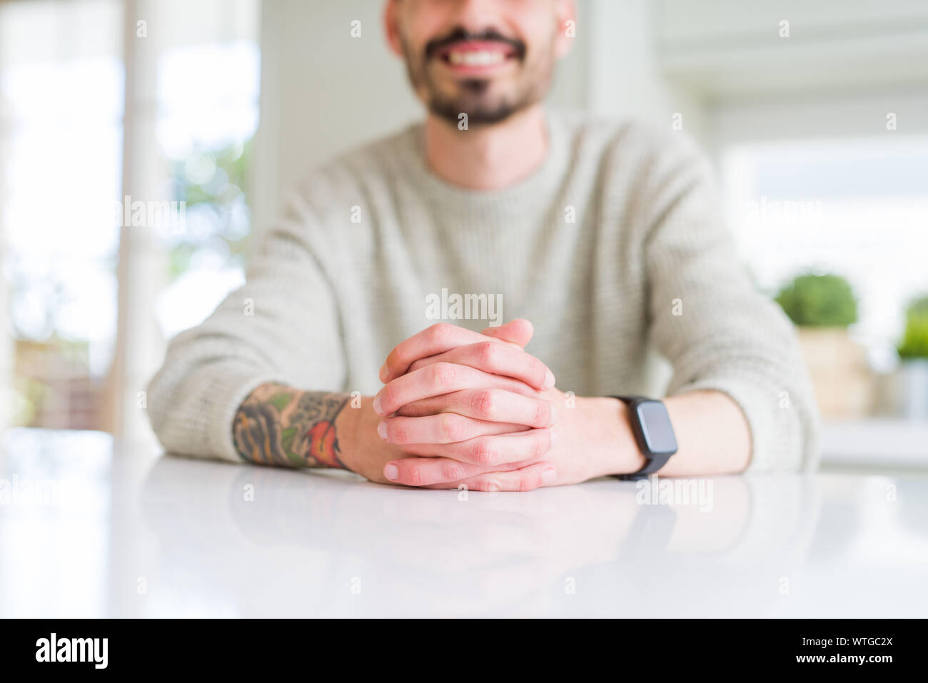 Close up of man hands over white table Stock Photo - Alamy