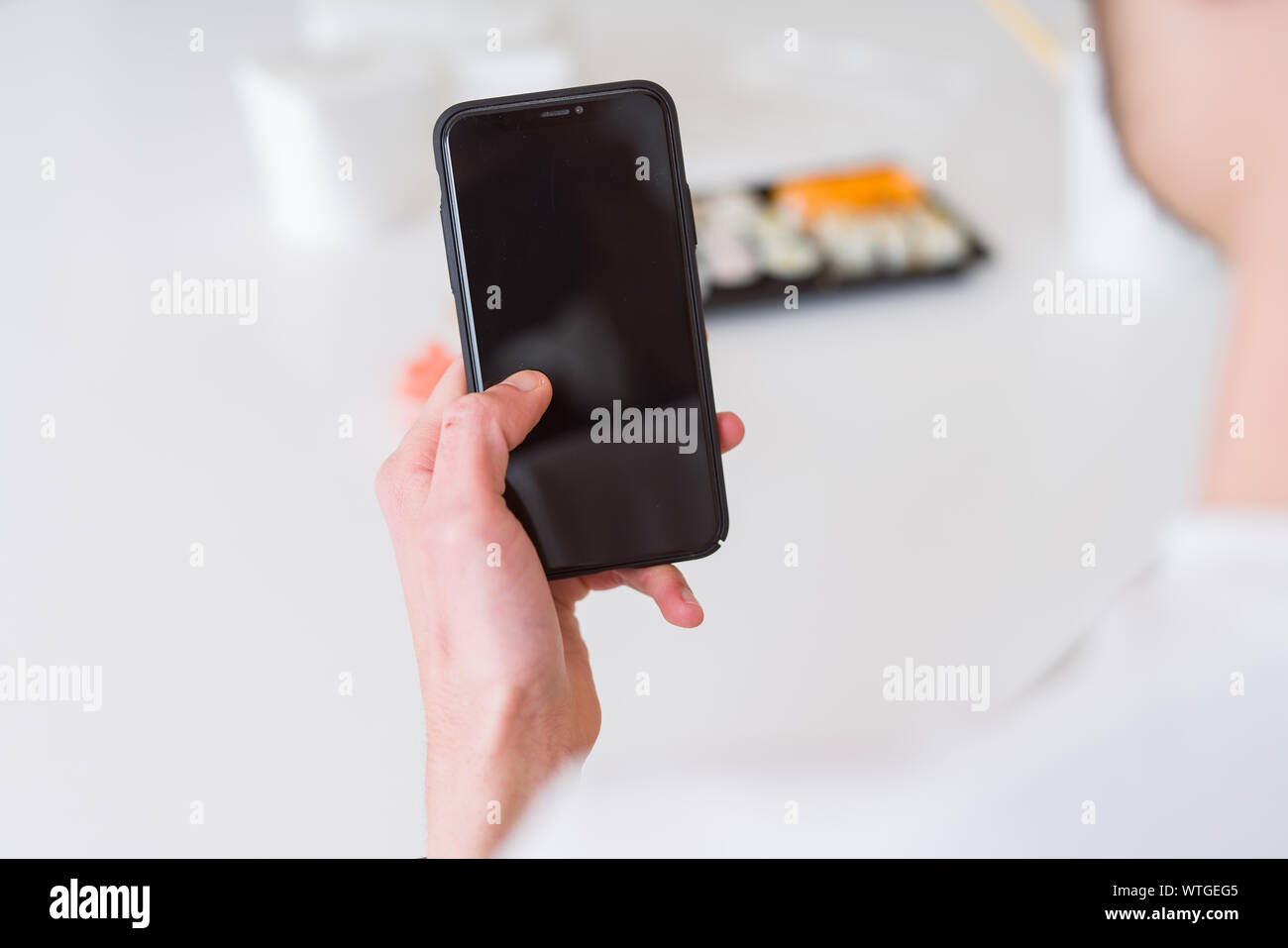 Using smartphone order food from hi-res stock photography and images ...