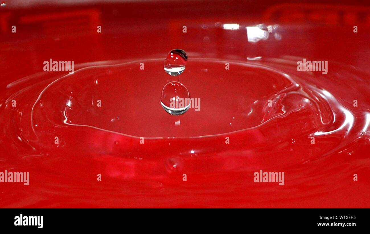 Water drop splashing hi-res stock photography and images - Alamy