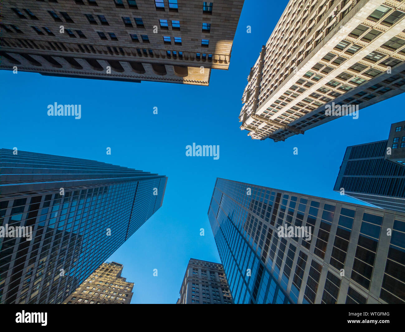 New York skyscrapers bottom view blue sky Stock Photo - Alamy