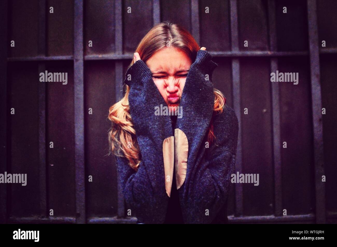 Hand squeezing face hi-res stock photography and images - Alamy