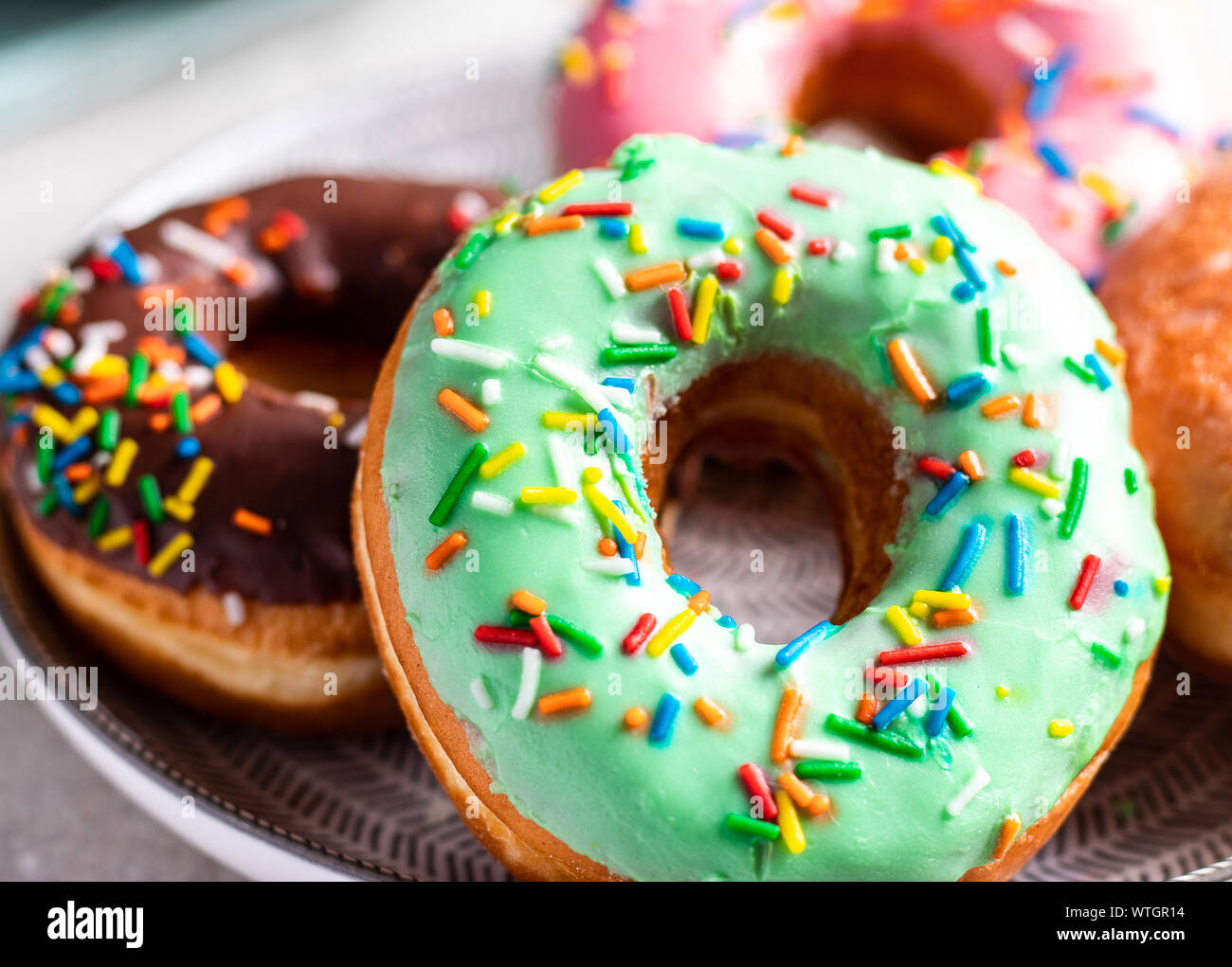 Front and top view of a group of sweet donuts, close up Stock Photo - Alamy