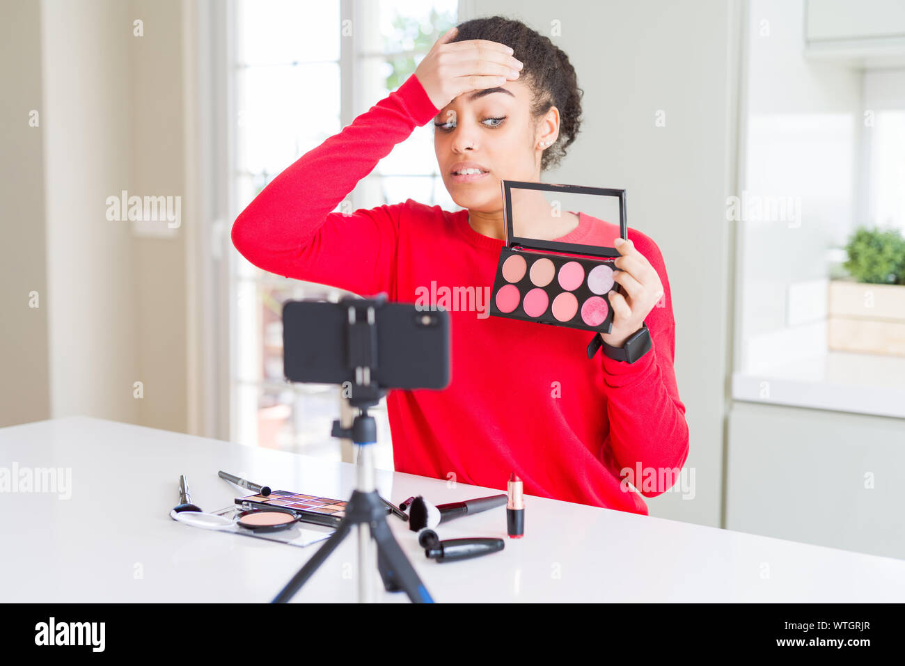 Young african american influencer woman recording make up tutorial ...