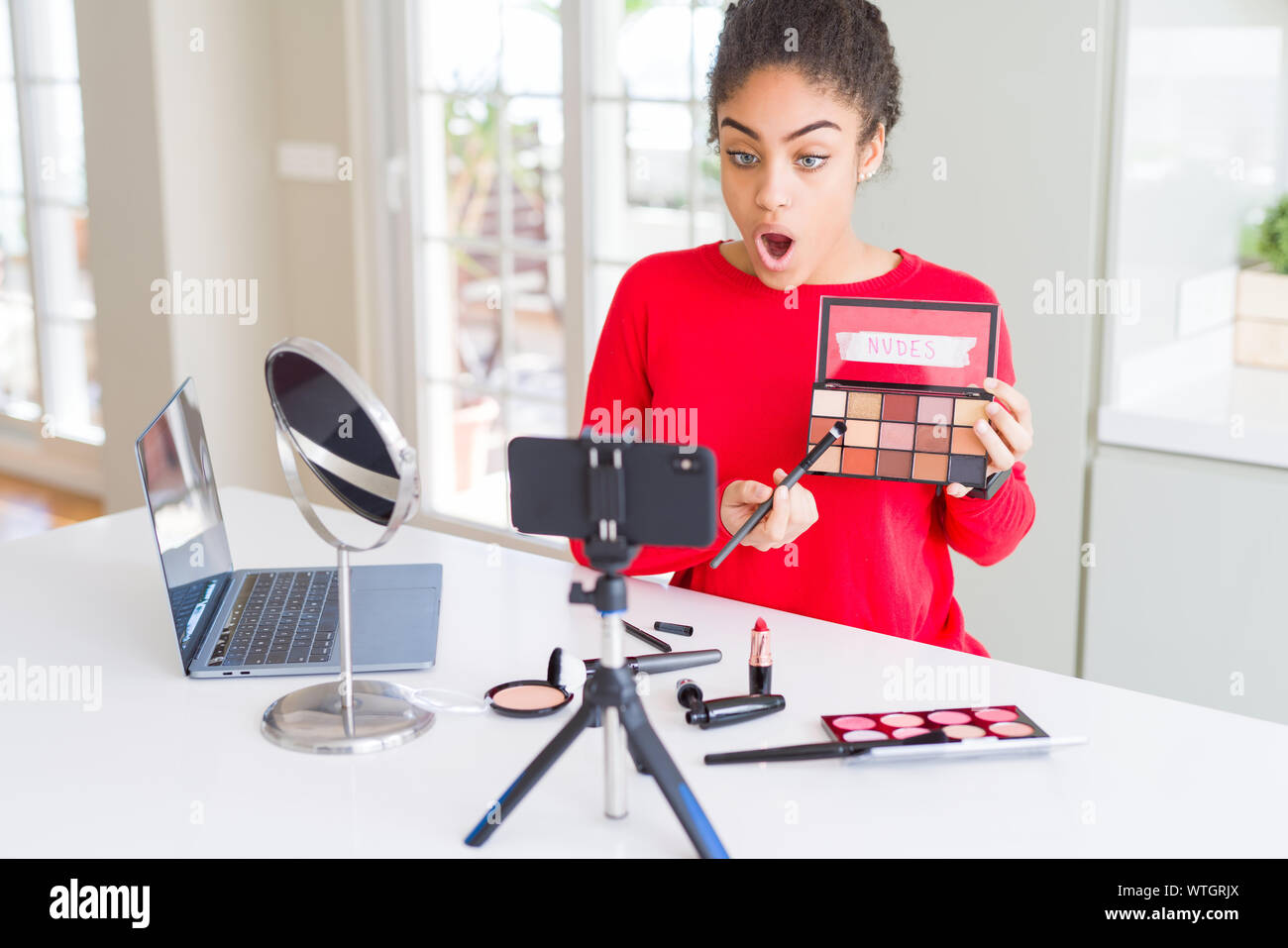 Young african american influencer woman recording make up tutorial ...