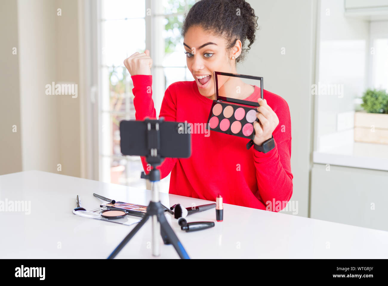 Young african american influencer woman recording make up tutorial ...