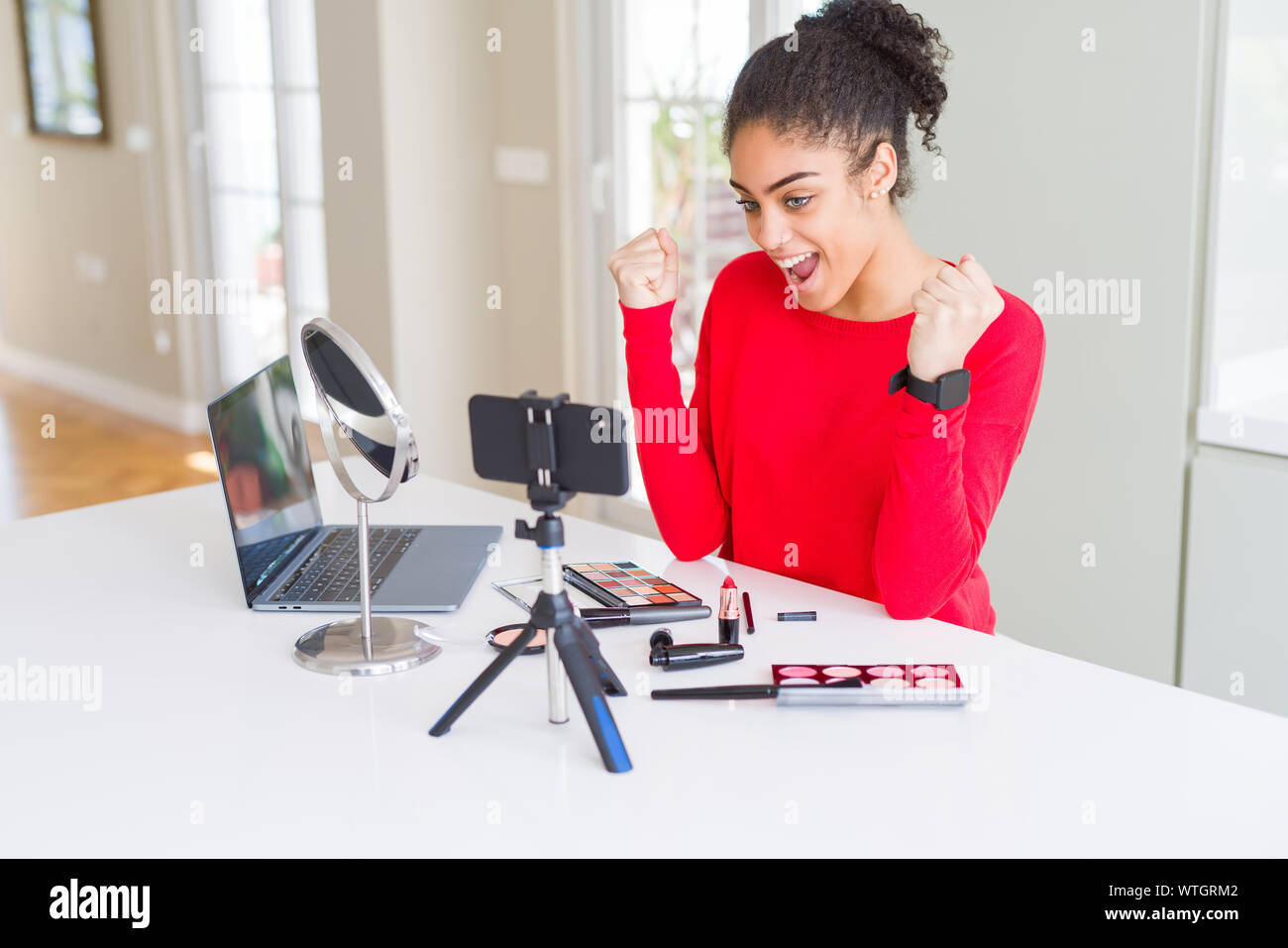 Young african american influencer woman recording make up tutorial ...
