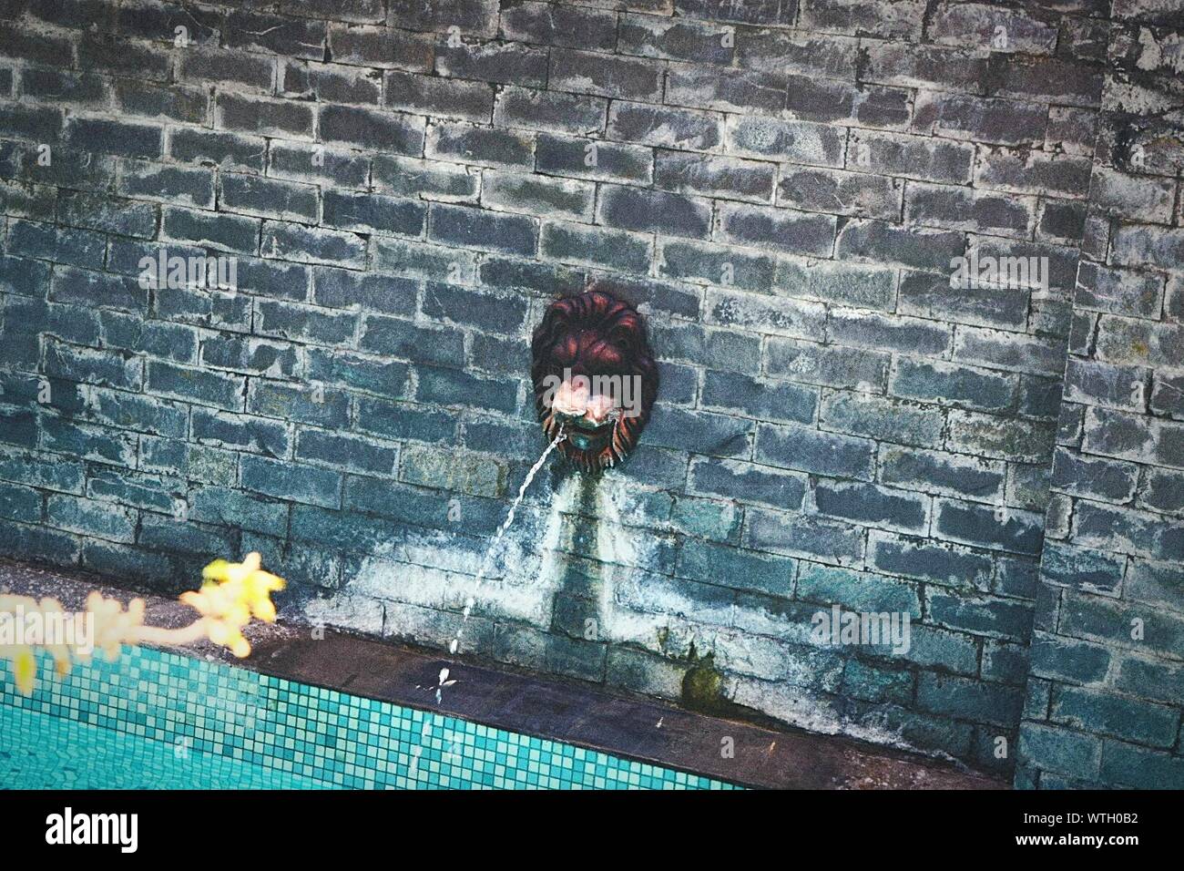 View Of Water Outlet On Wall Stock Photo - Alamy