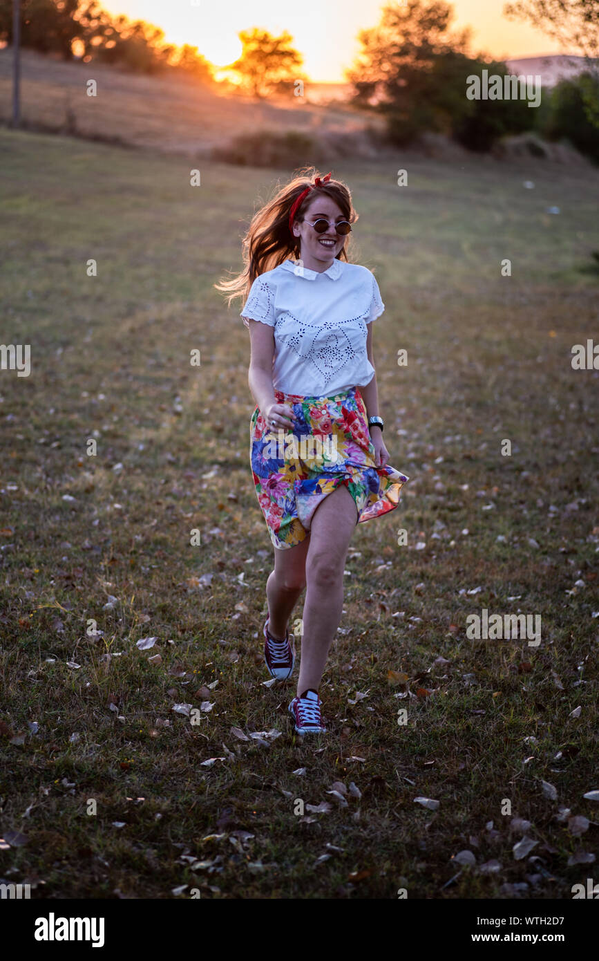 Girl running through field hi-res stock photography and images - Alamy