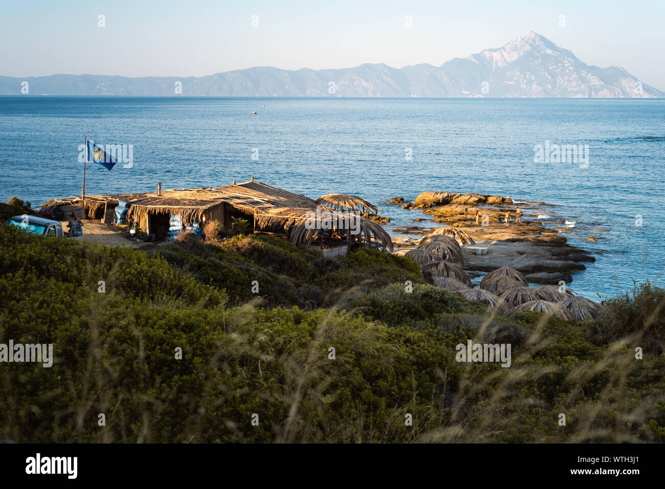 TIGANIA BEACH, GREECE- AUGUST 23, 2019: Tourists enjoying Tigania beach ...