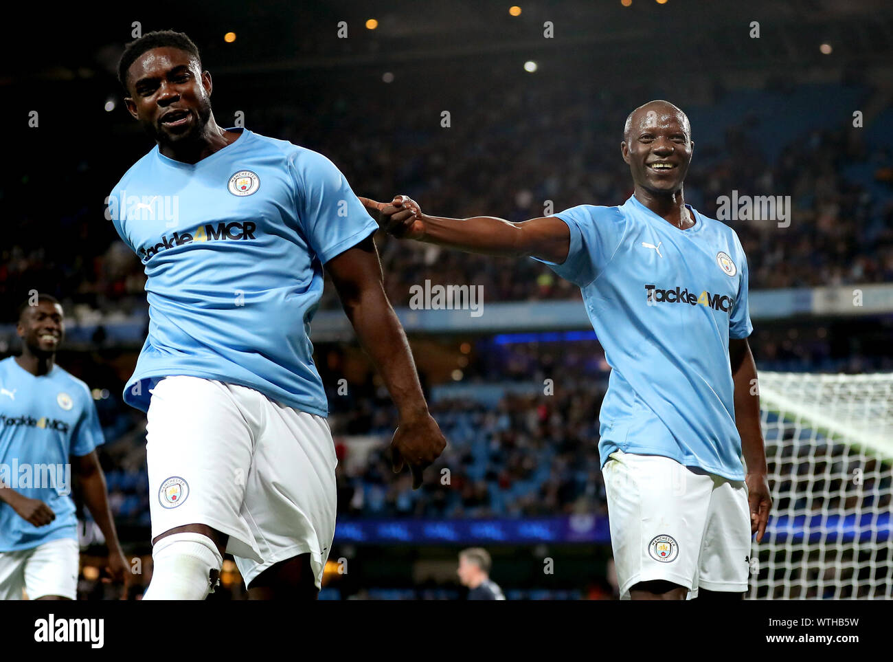 Manchester City Legend's Benjani (right) celebrates scoring his side's ...