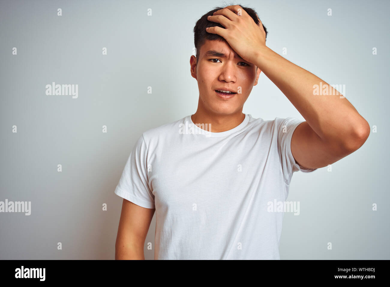 Young Asian Chinese Man Wearing T Shirt Standing Over Isolated White