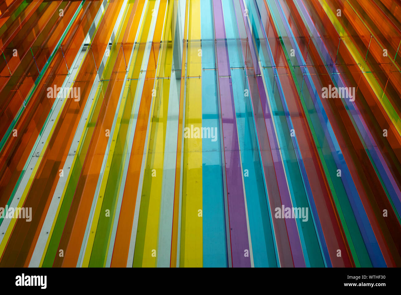 Vertical colourful stripes inside building. Converging lines decoration ...