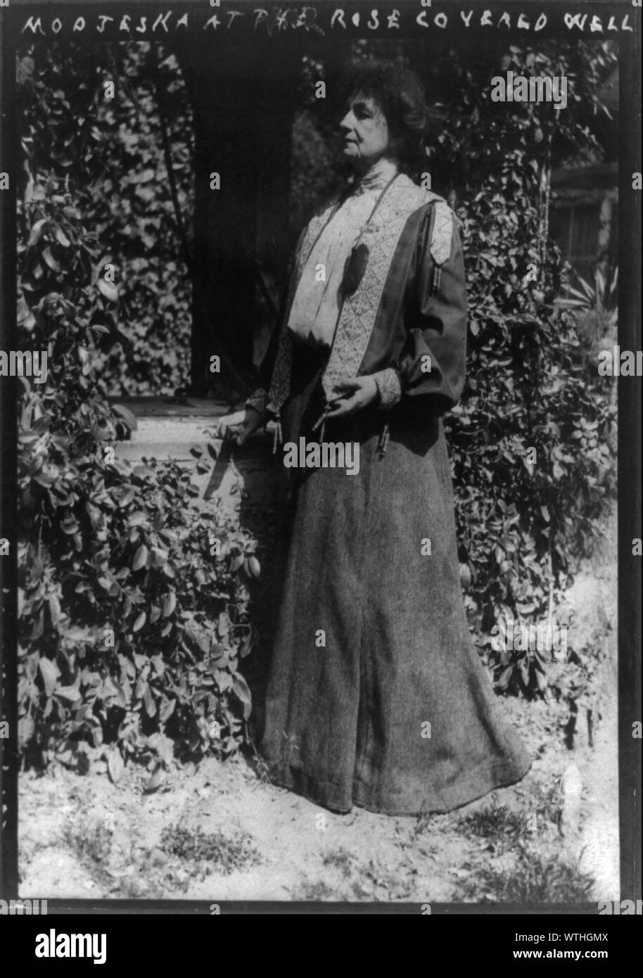 Modjeska at her rose covered well Stock Photo - Alamy