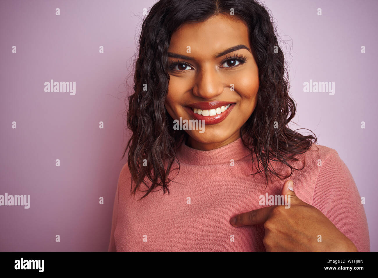 Young beautiful transsexual transgender woman standing over isolated ...