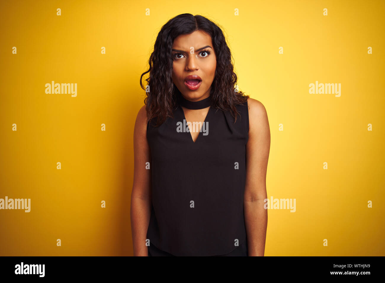 Transsexual transgender elegant businesswoman standing over isolated ...