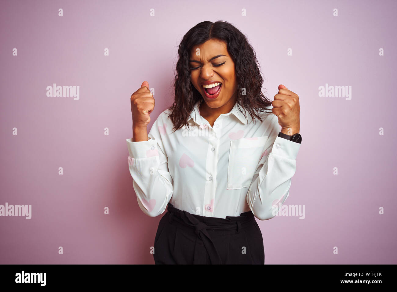 Transsexual transgender businesswoman standing over isolated pink ...