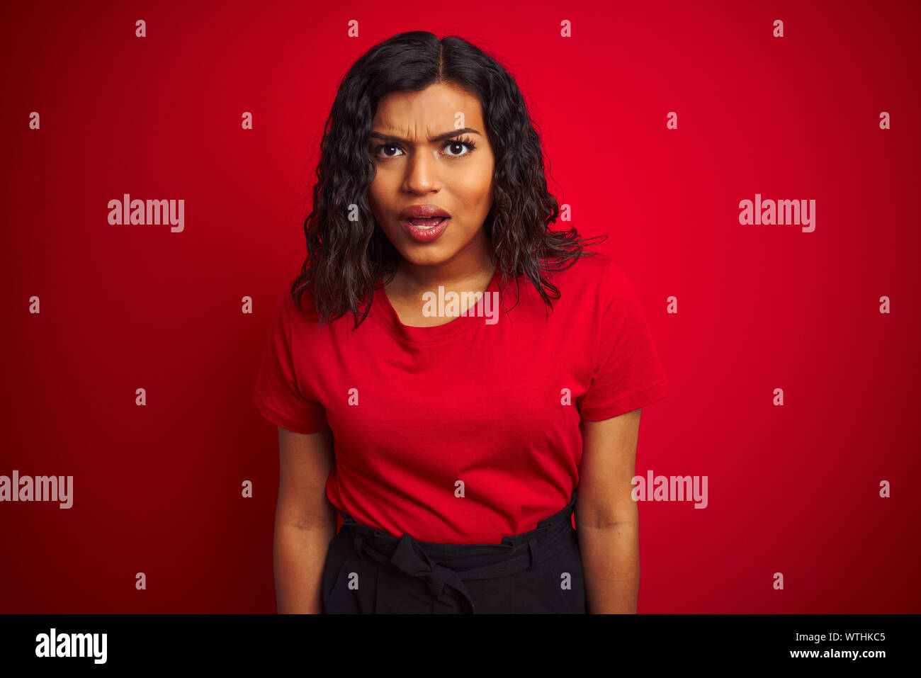 Beautiful transsexual transgender woman wearing t-shirt over isolated ...