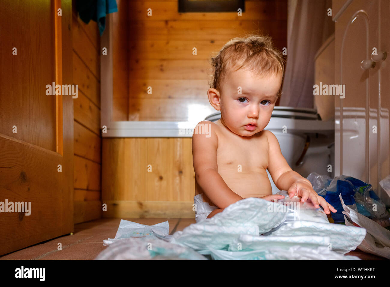 Busy baby making a mess is a daily scene at home Stock Photo - Alamy