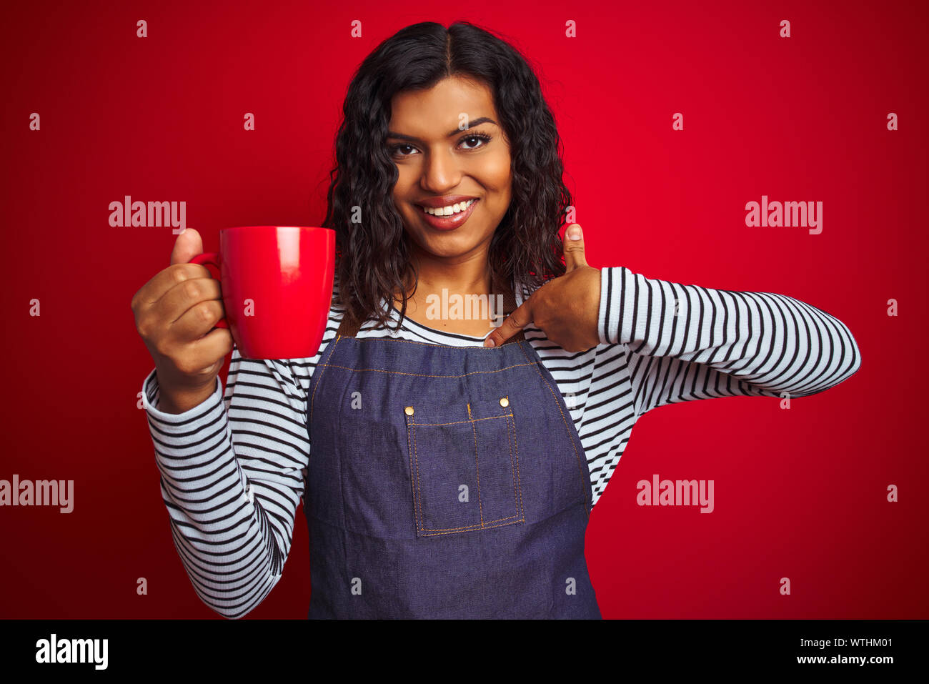 Transsexual transgender barista woman holding cup of coffee over ...
