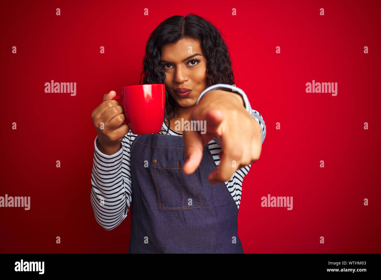 Transsexual transgender barista woman holding cup of coffee over ...