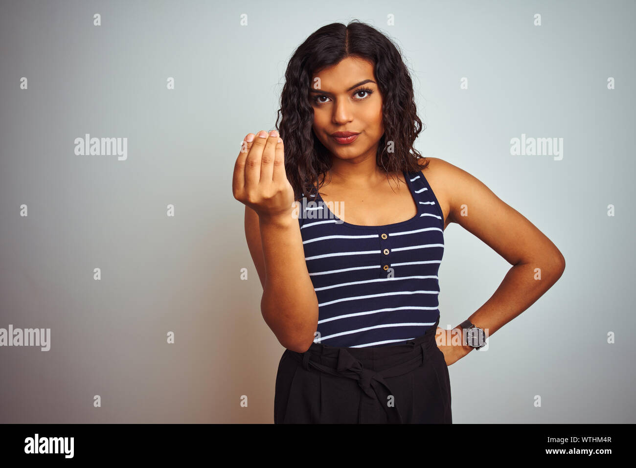 Transsexual transgender woman wearing striped t-shirt over isolated ...
