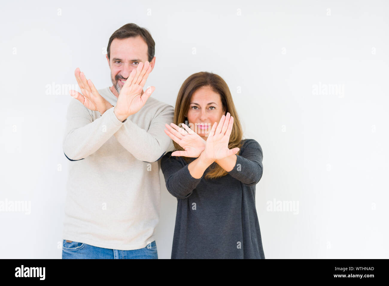Beautiful middle age couple in love over isolated background Rejection ...
