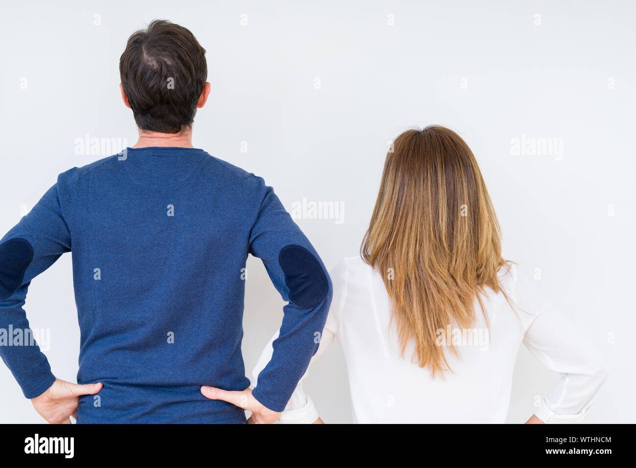 Beautiful middle age couple in love over isolated background standing ...